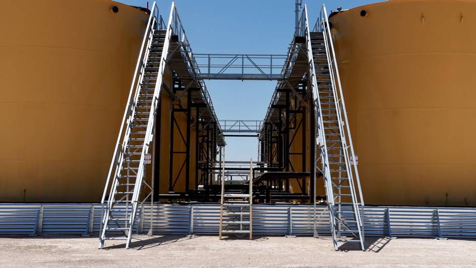 Oil holds gains on signs of shale slowdown as OPEC output falls